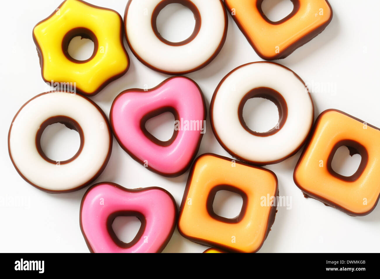 Fondant candies half coated in chocolate Stock Photo - Alamy