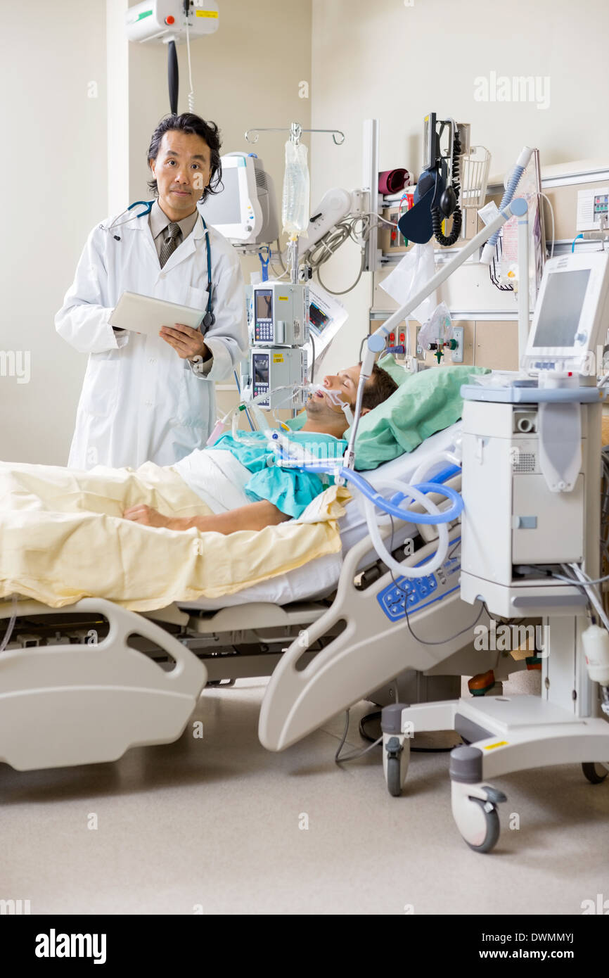 Doctor Examining Patient's Test Report On Digital Tablet Stock Photo ...