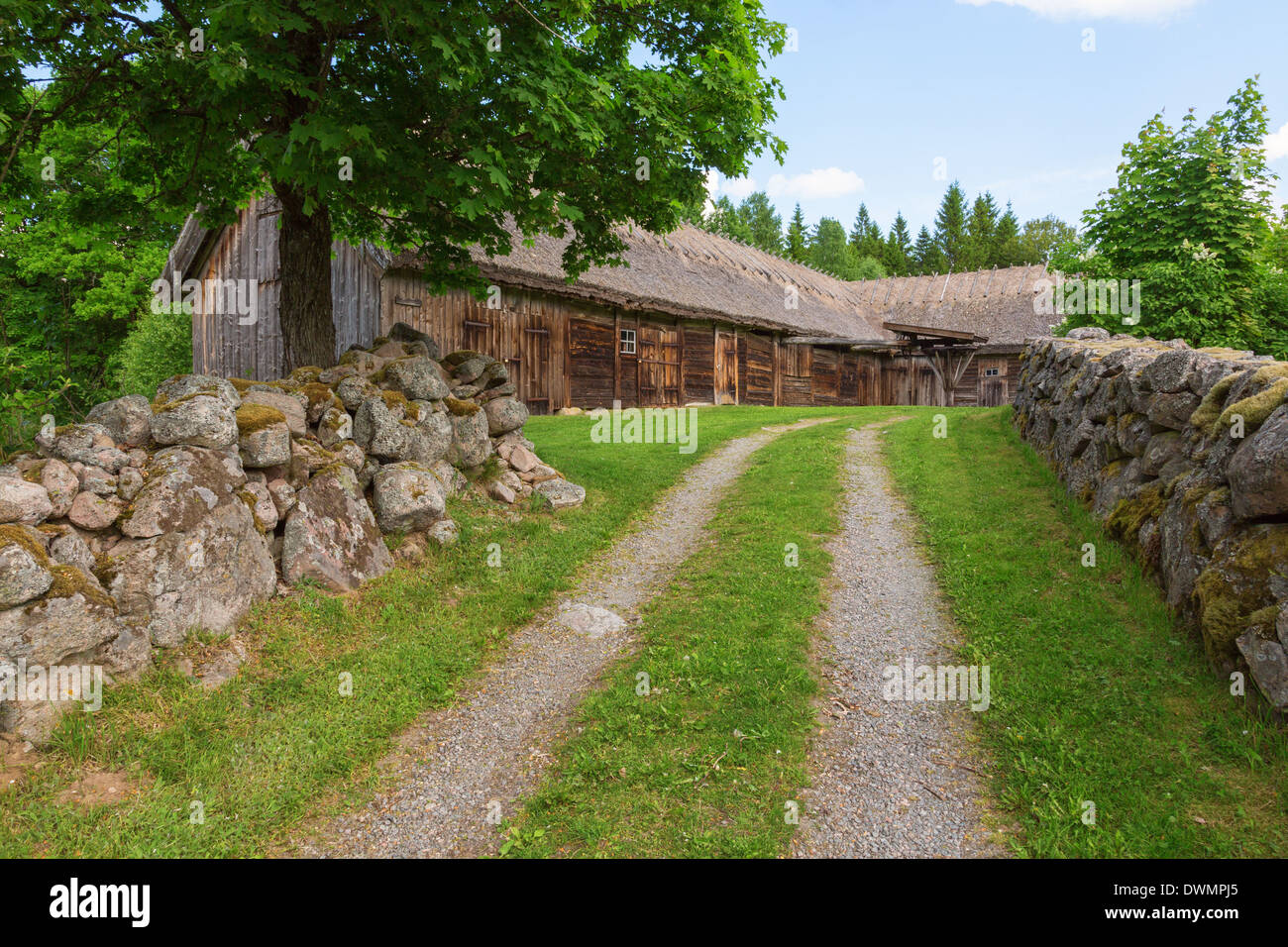 Country road to the old barn Stock Photo - Alamy