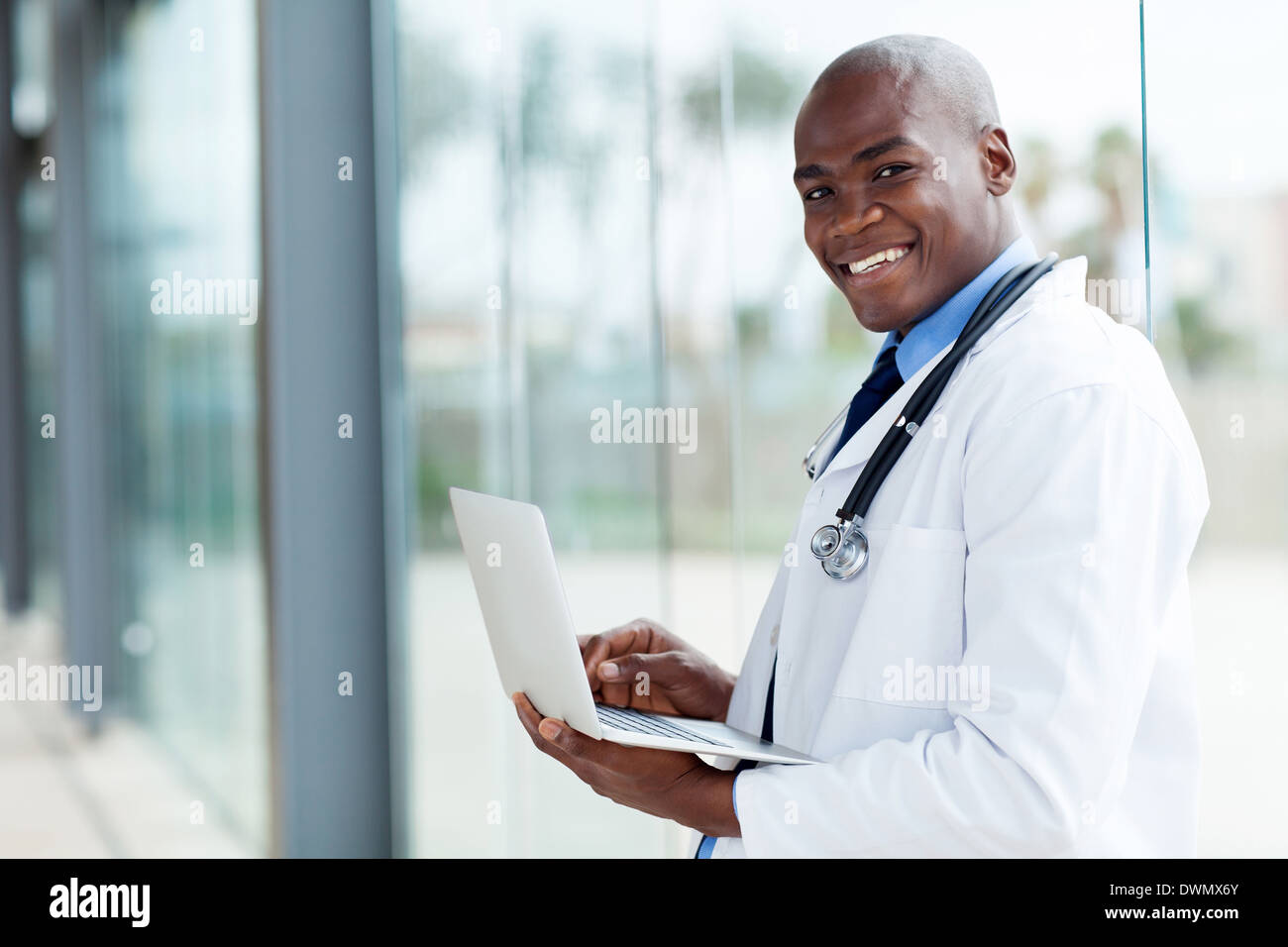 portrait of afro American doctor using laptop computer Stock Photo - Alamy