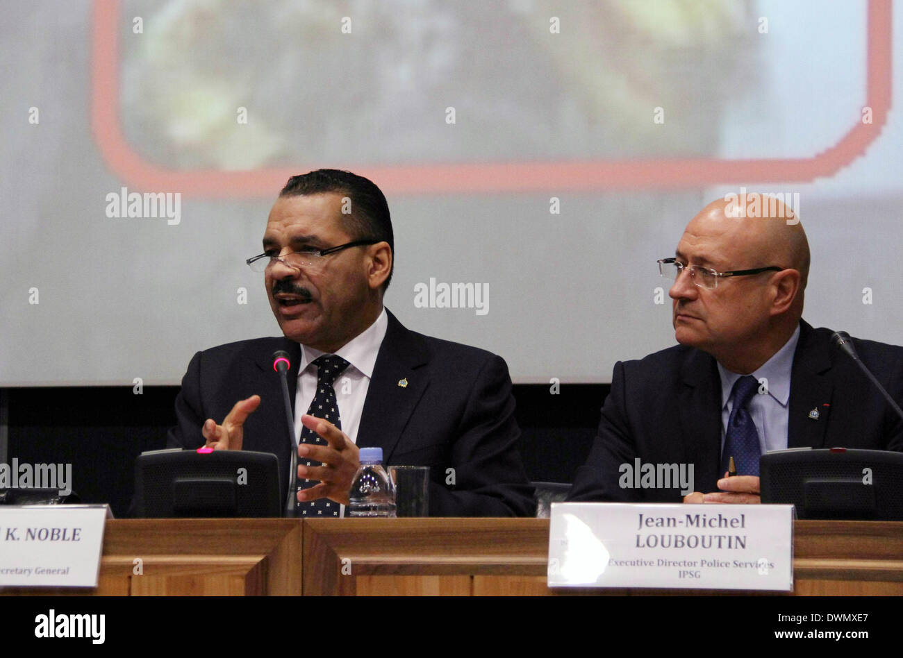 Lyon. 11th Mar, 2014. Interpol Secretary General Ronald K. Noble (L ...