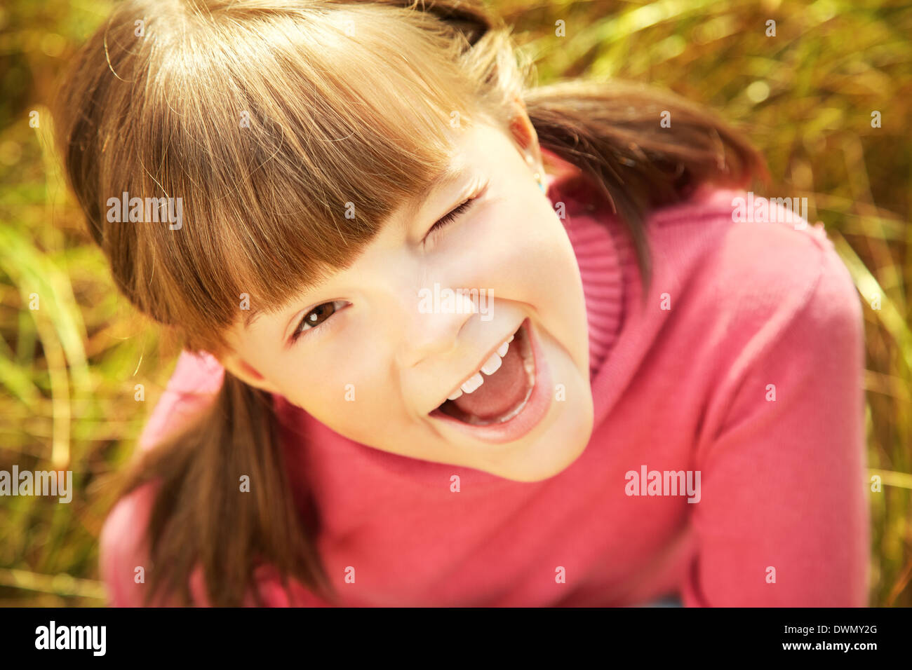 Portrait of cheerful girl Stock Photo - Alamy