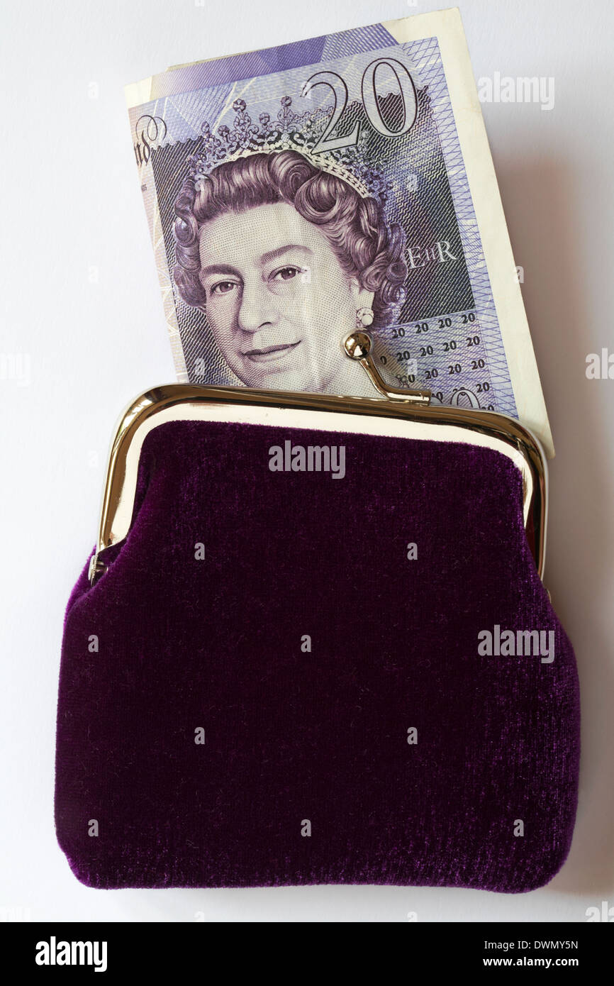 purple purse with £20 note isolated on white background - twenty pounds ...