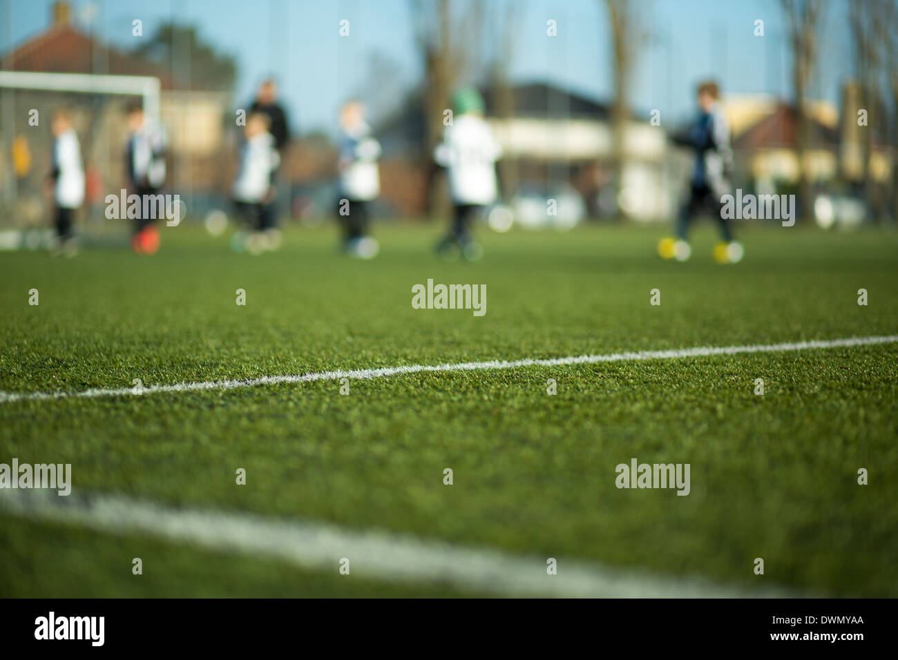 Children playing soccer in field hi-res stock photography and images ...