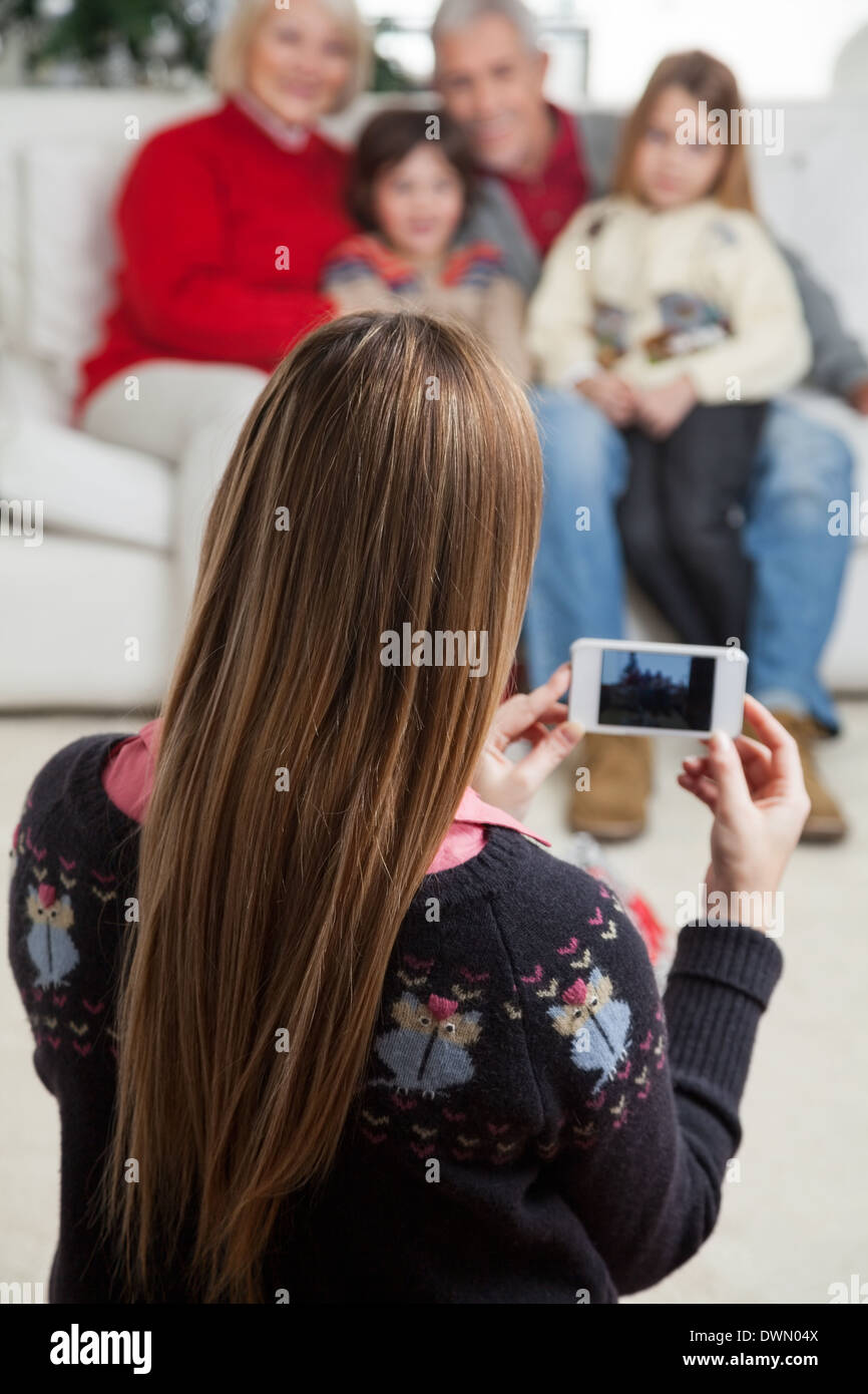Mother Photographing Family Through Smartphone Stock Photo - Alamy