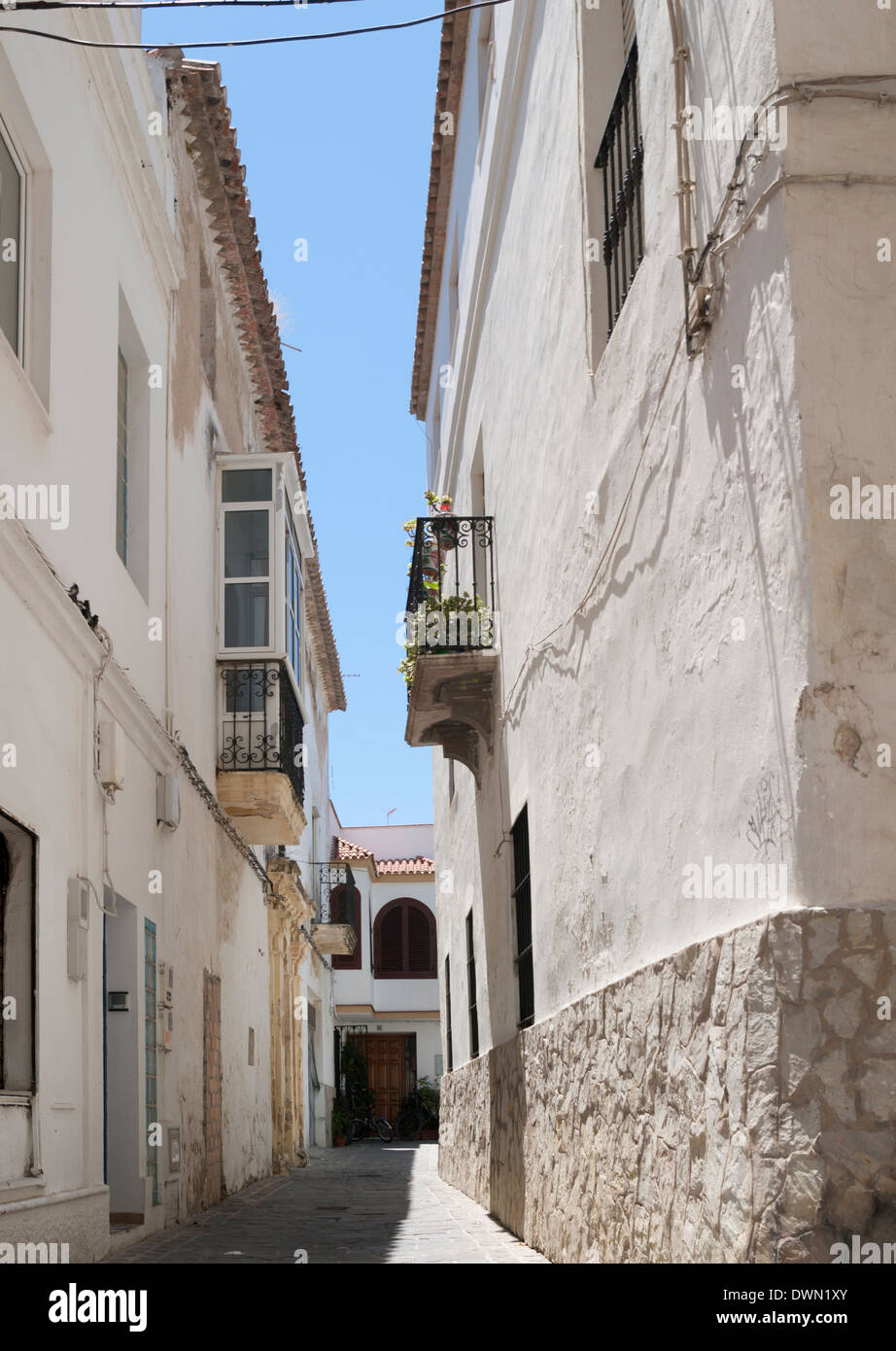 The streets of Tarifa, Spain, narrow and shady, offering some respite ...