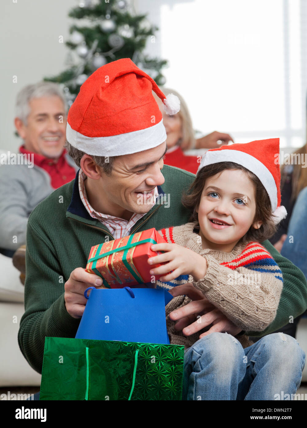Women with father christmas hi-res stock photography and images - Alamy
