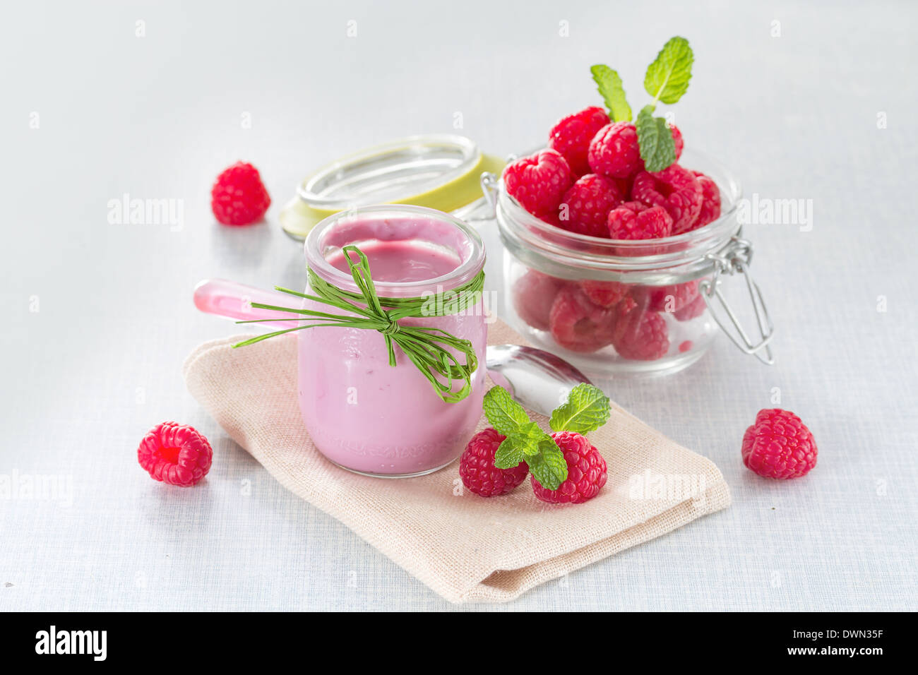 Raspberry yogurt with ripe raspberries Stock Photo - Alamy