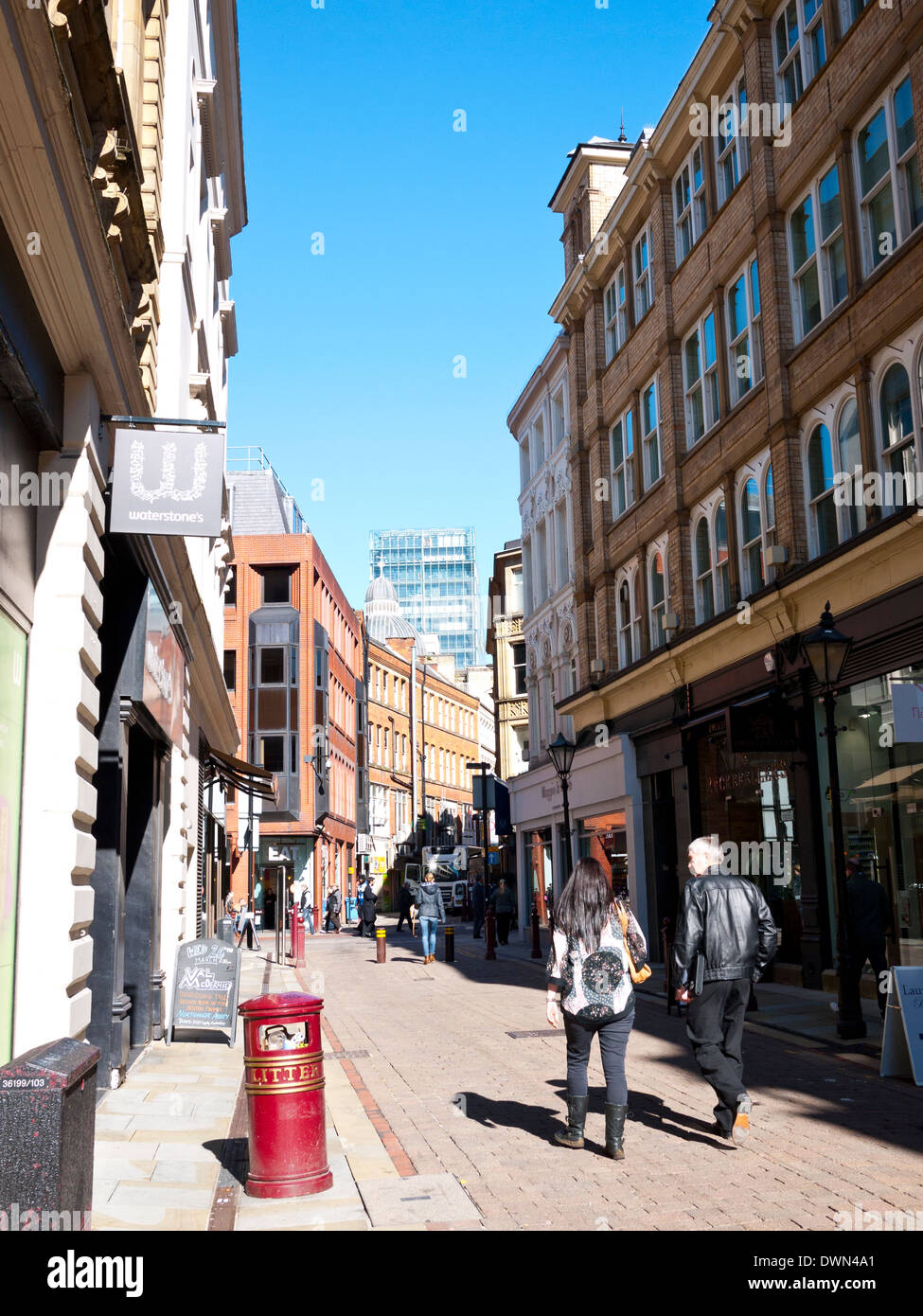 People walking down narrow streets of central Manchester, Manchester UK ...