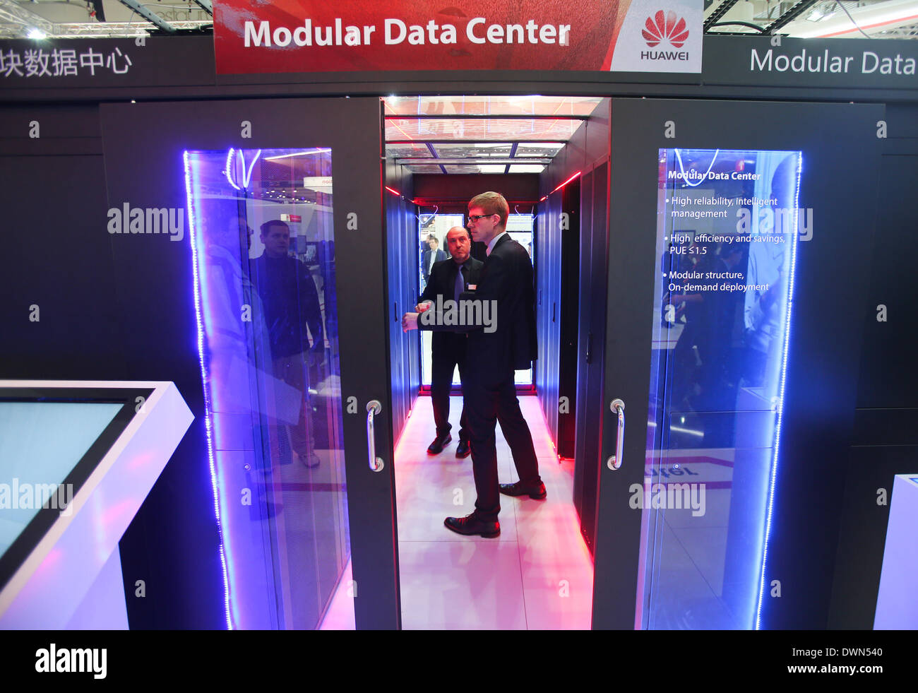 Hanover, Germany. 11th Mar, 2014. Visitors view a model product of modular data center at Huawei ...