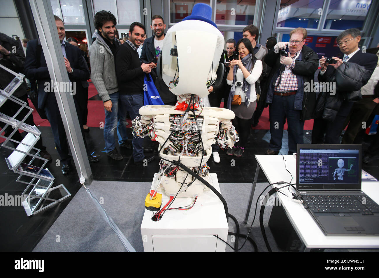 Hanover, Germany. 11th Mar, 2014. Visitors view "Roboy", a humanoid robot, at the Swiss Pavilion ...