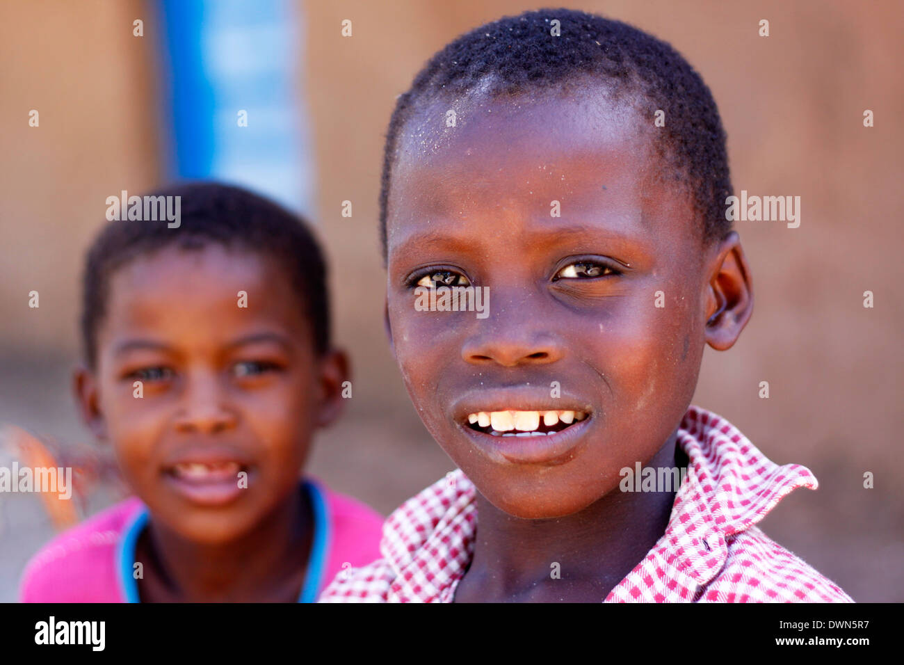 Mozambican children sitting on the ground in Quirimbas National Park ...