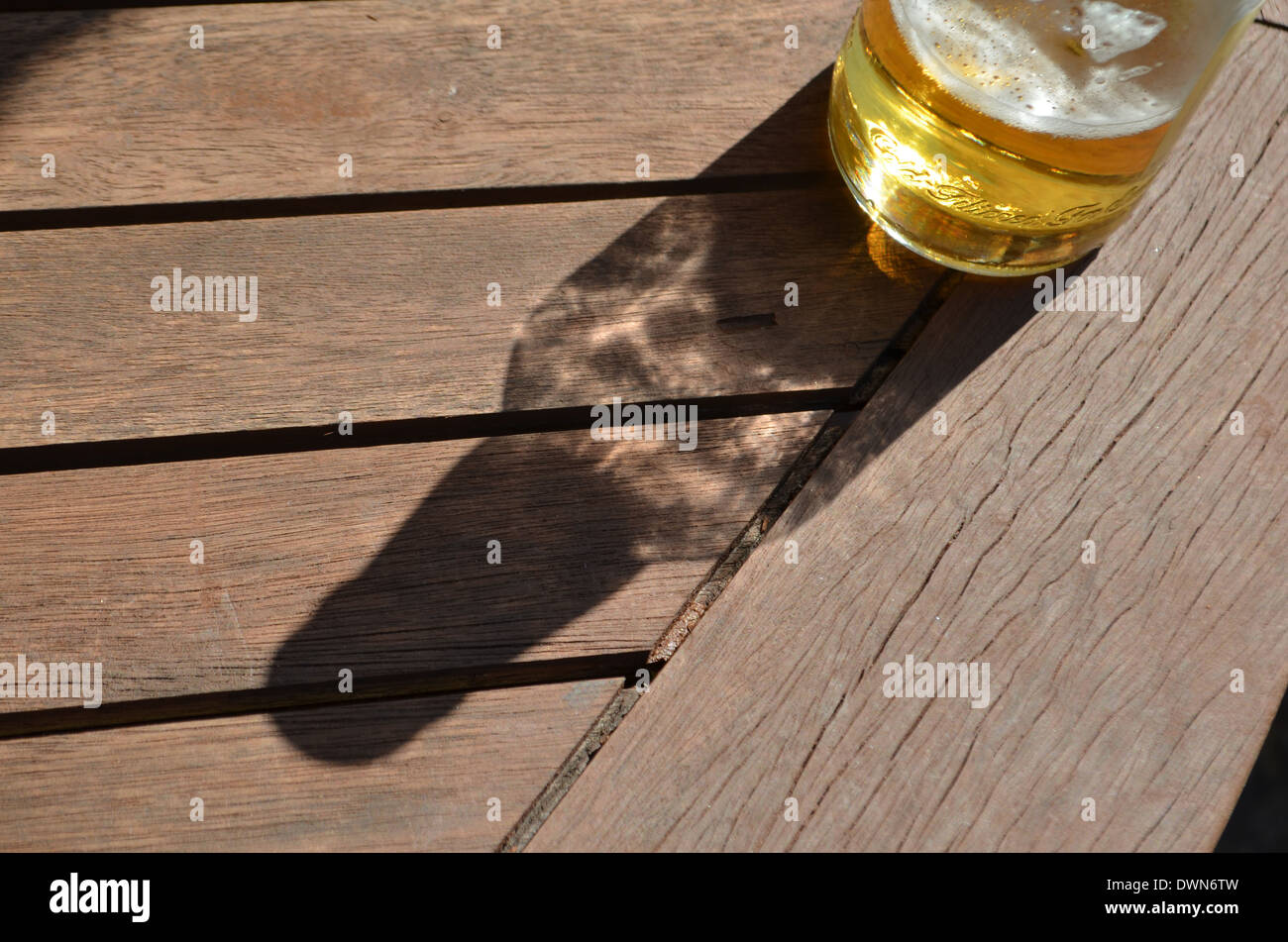 A cool beer on a hot day in the garden Stock Photo - Alamy