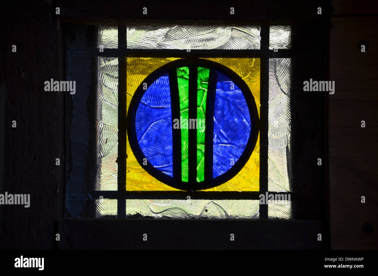 Leaded coloured glass window in garden shed Stock Photo - Alamy