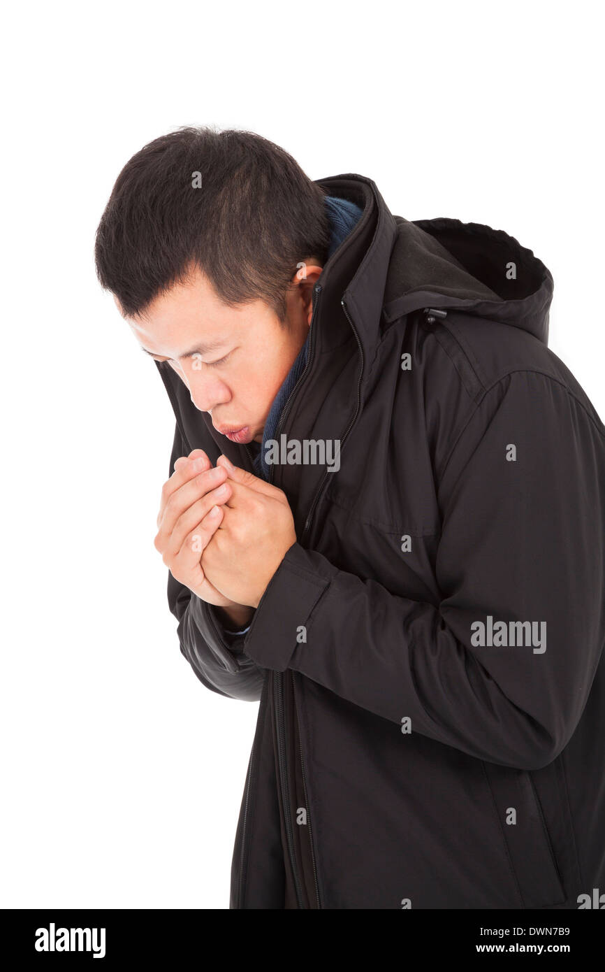 asian young man blowing to warm hands in cold day Stock Photo - Alamy