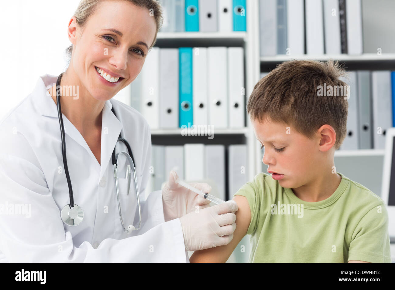 Little boy receiving injection by pediatrician Stock Photo - Alamy
