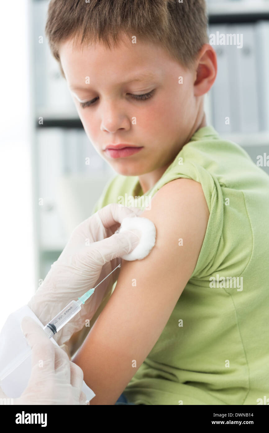 Boy receiving vaccination in arm Stock Photo - Alamy