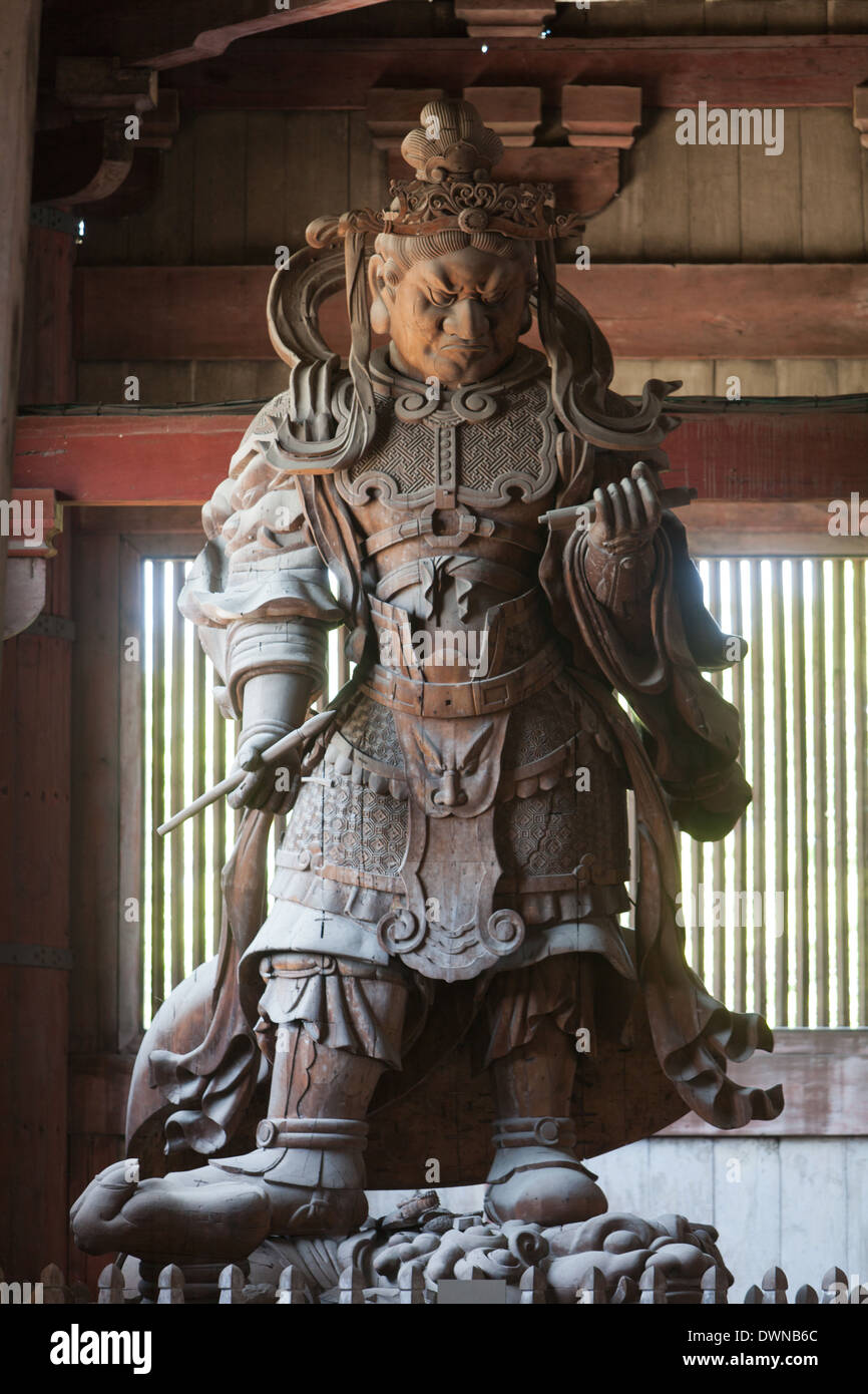 A large wooden statue of a deity at the Great Buddha Hall, part of ...