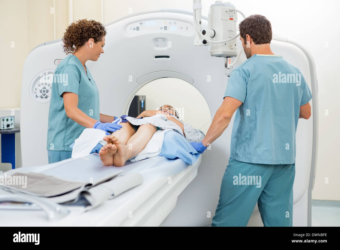 Nurses Preparing Patient For CT Scan Stock Photo - Alamy