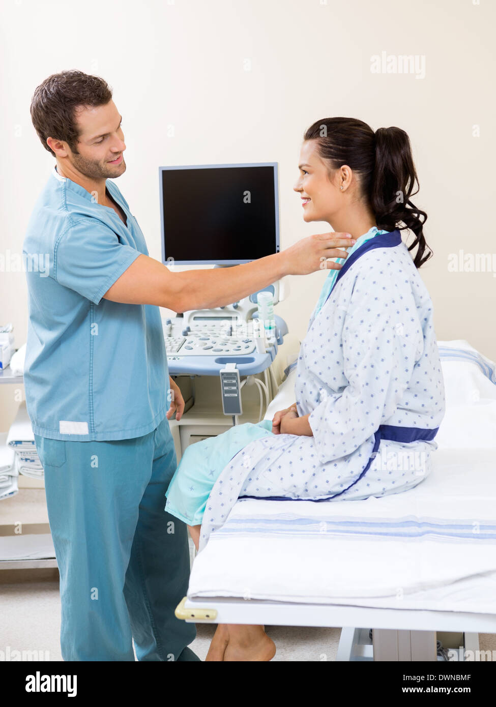 Nurse Examining Patient's Neck Before Ultrasound Test Stock Photo - Alamy