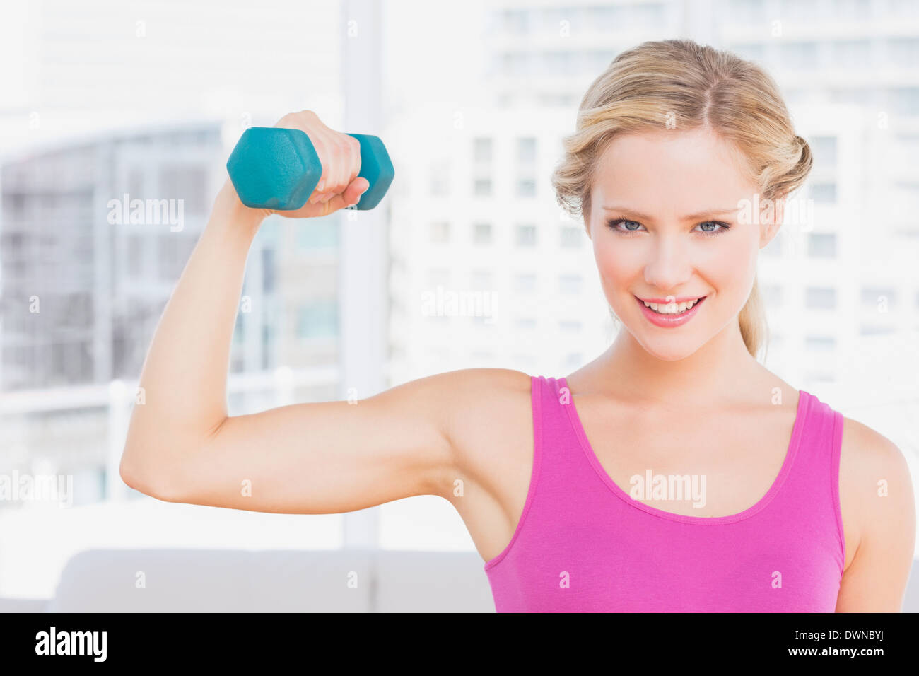 Happy woman dumbbell flexing hi-res stock photography and images - Alamy