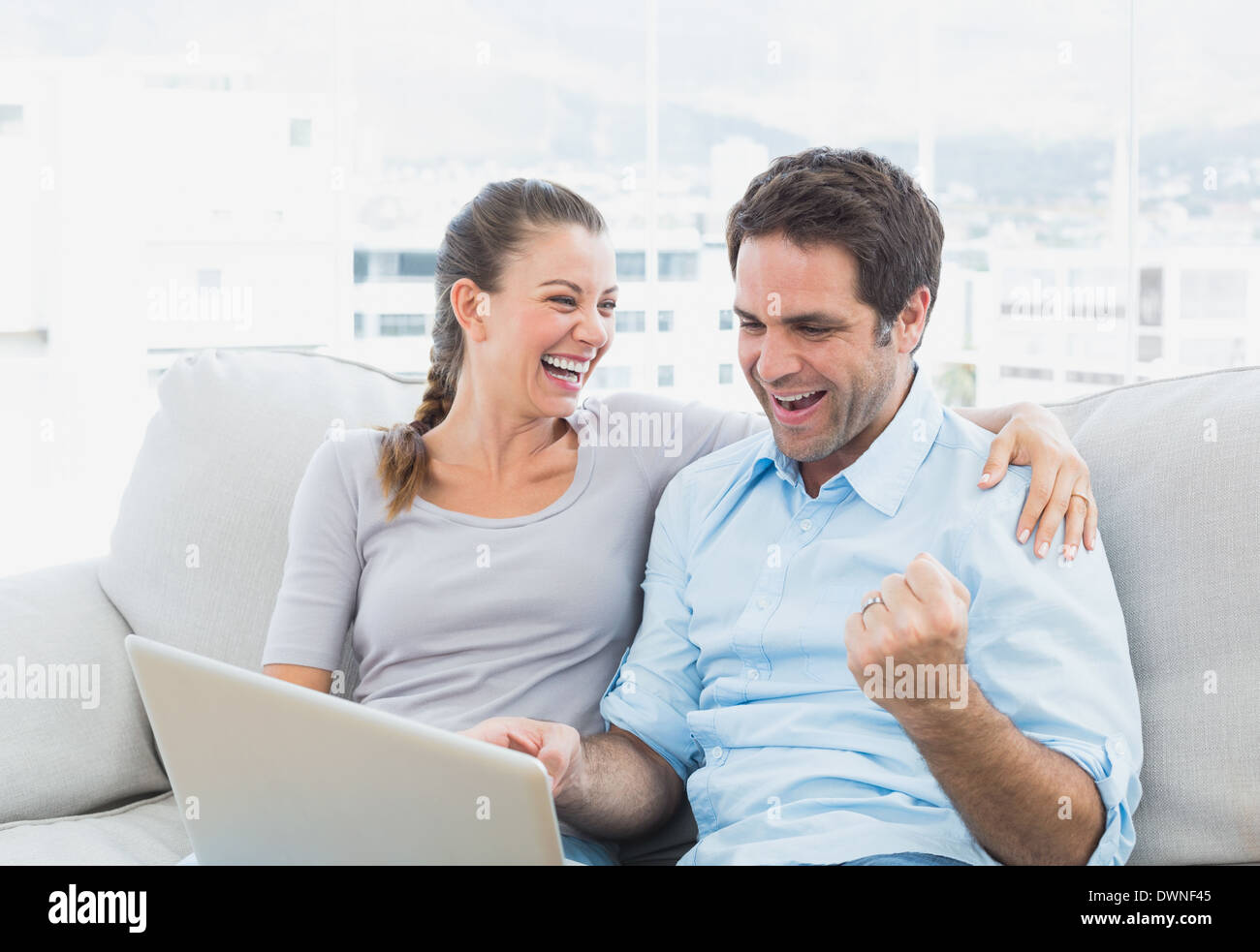 Couple excited laptop hi-res stock photography and images - Alamy