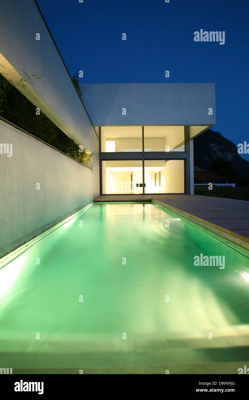 modern house with pool in the night, exterior Stock Photo - Alamy