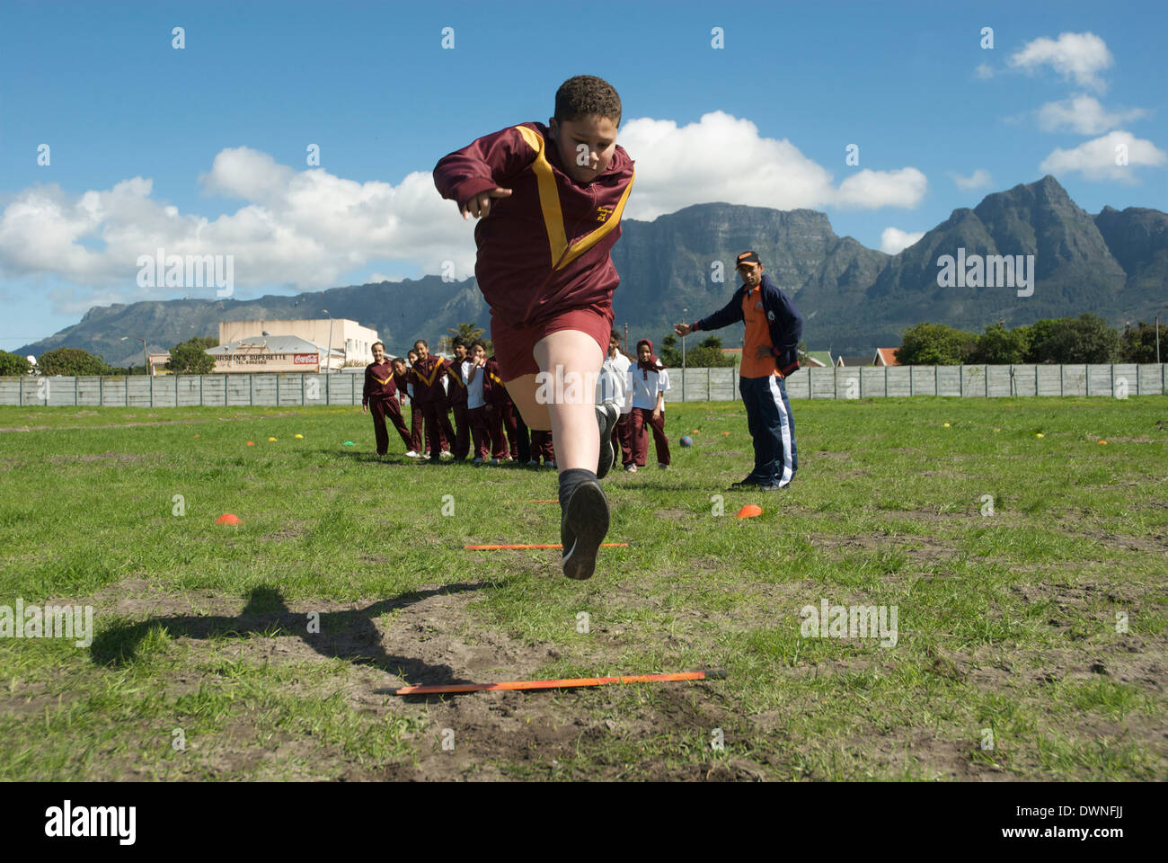 A boy plays three sticks in physical education class, Rondebosch, Cape ...