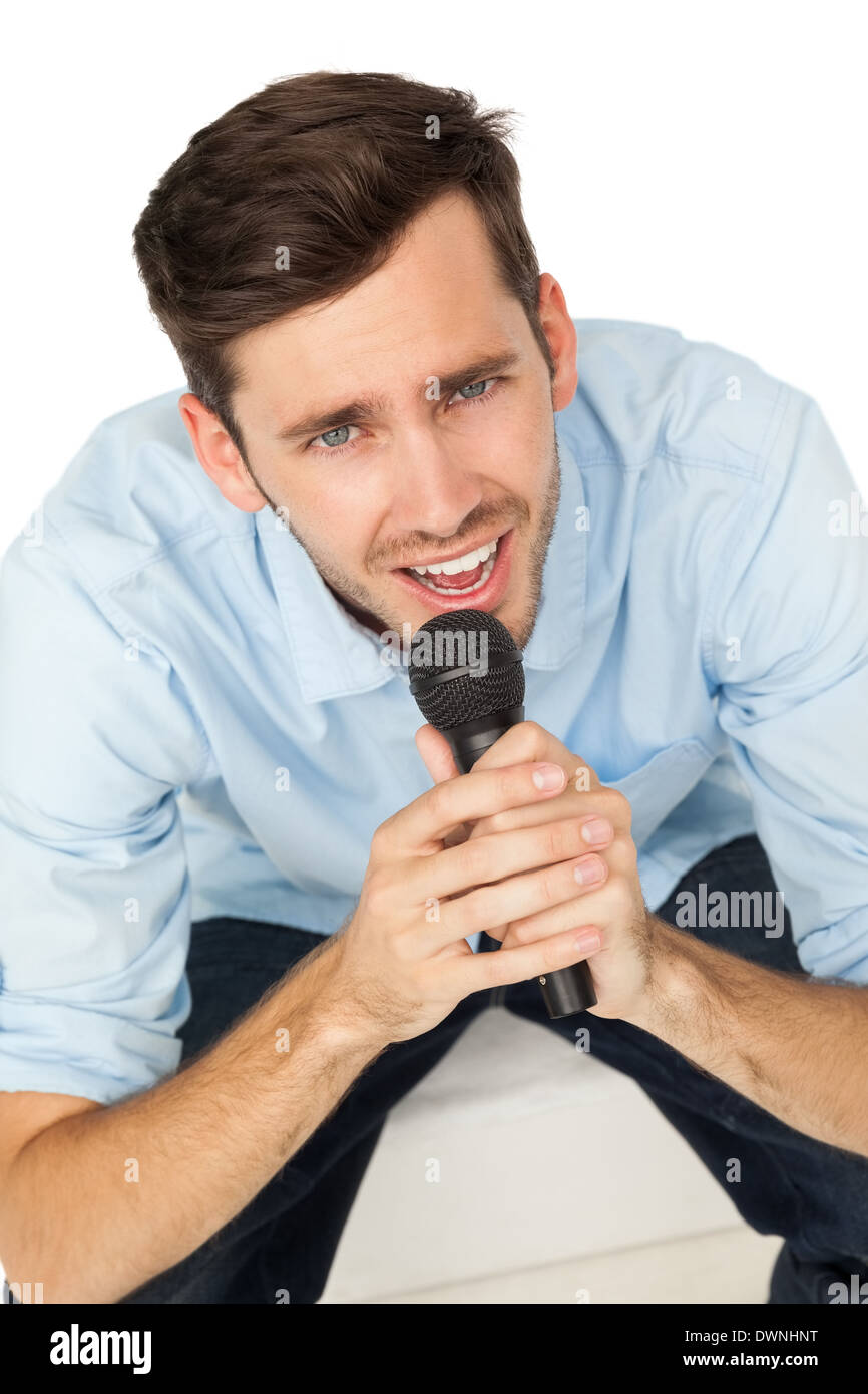 Man singing into microphone hi-res stock photography and images - Alamy