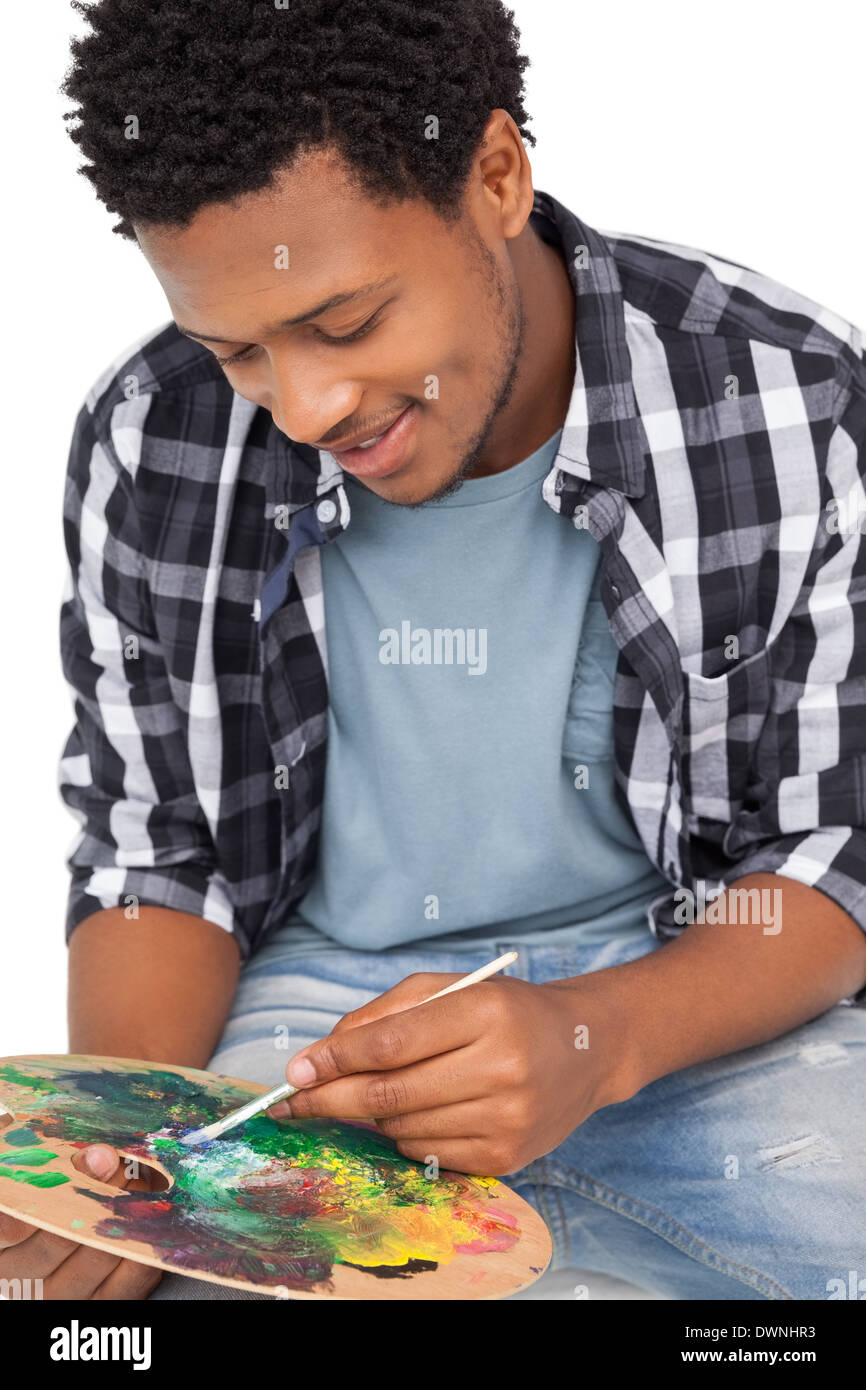 Young happy male artist painting hi-res stock photography and images ...