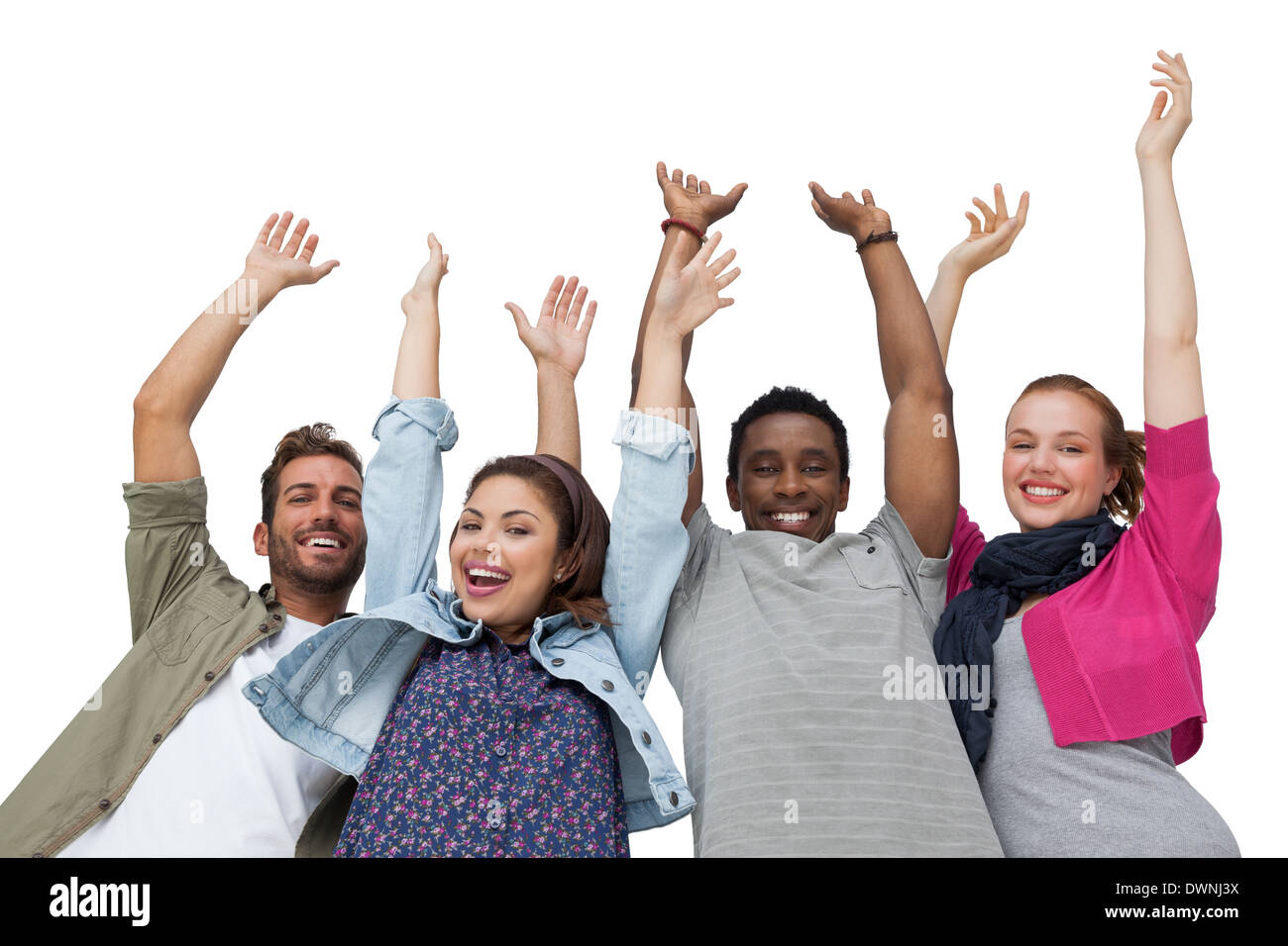 Portrait of four young friends raising hands Stock Photo - Alamy