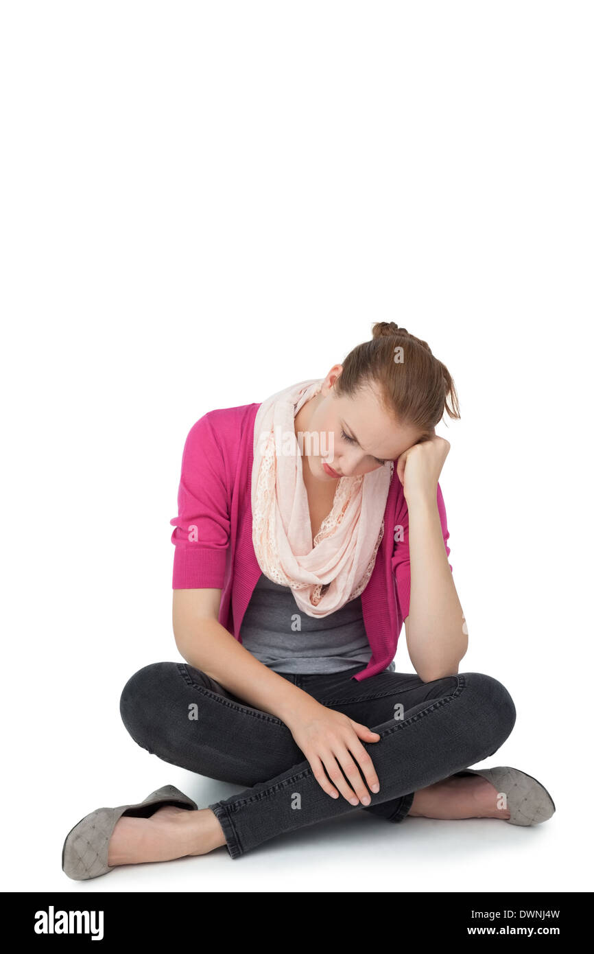Young woman crossed legs sitting sad hi-res stock photography and ...