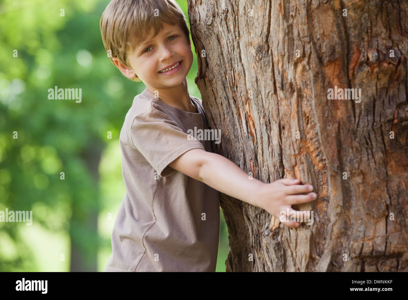 Boy Hugging Tree Trunk High Resolution Stock Photography and Images - Alamy