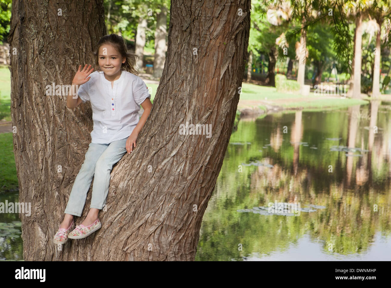 Girl sitting on tree hi-res stock photography and images - Alamy