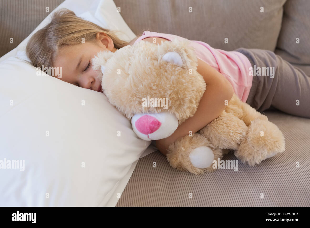 Girl lying on sofa teddy hi-res stock photography and images - Alamy