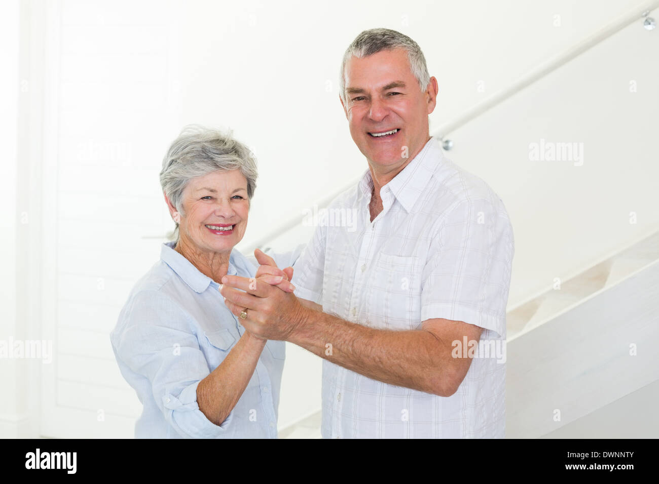Happy senior couple dancing together Stock Photo - Alamy