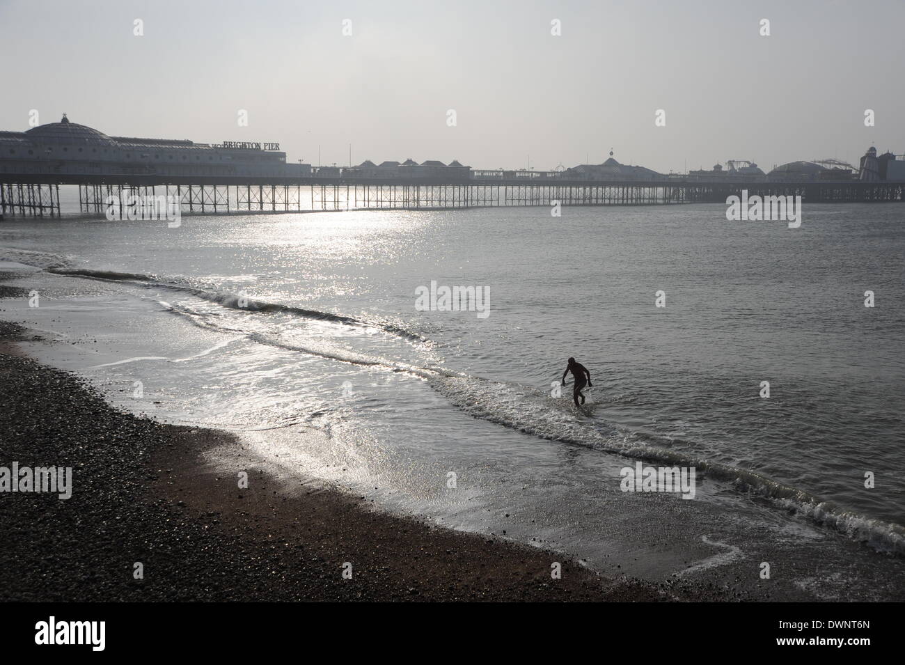 Male swimmer walking into sea hi-res stock photography and images - Alamy