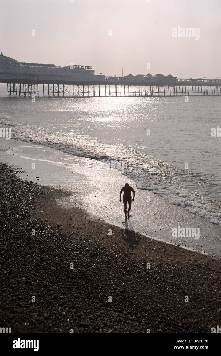 Swimmer walking out of the sea hi-res stock photography and images - Alamy