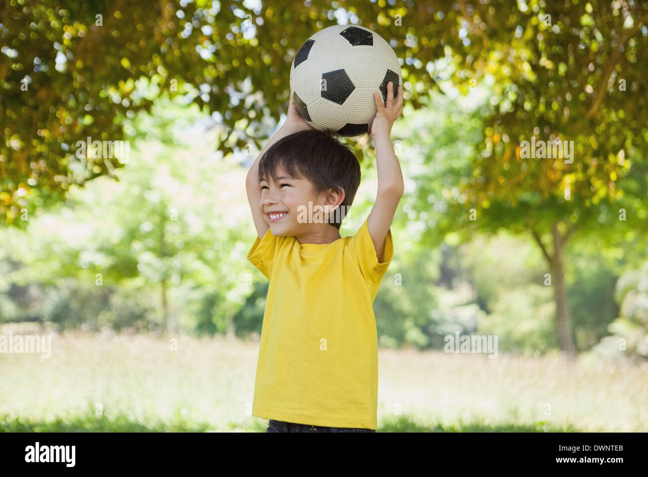Boy throwing football hi-res stock photography and images - Alamy