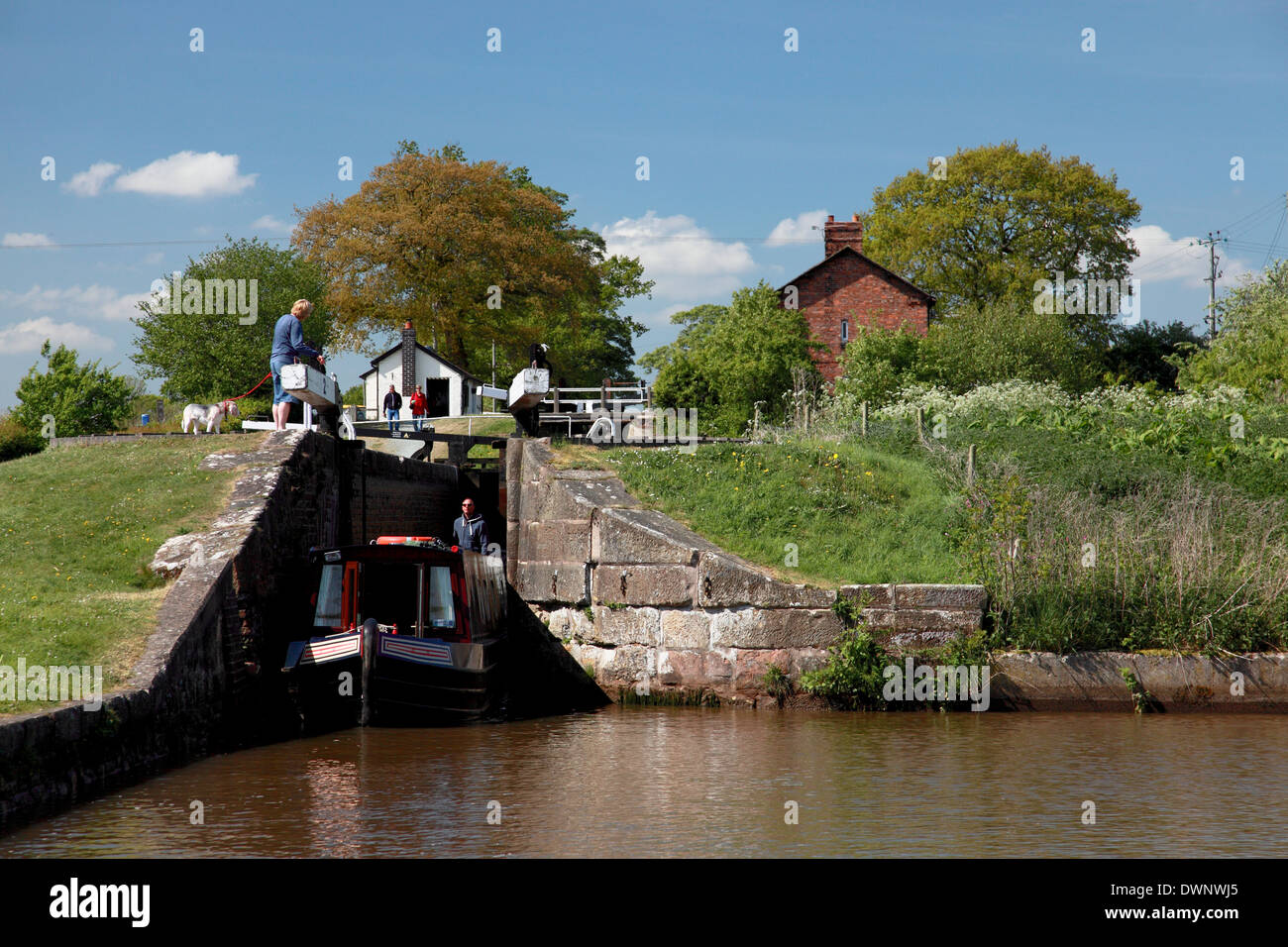 A narrowboat emerging from lock 2 of the Hurleston flight of four locks ...
