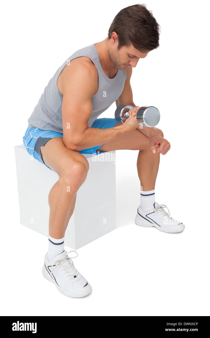 Side view of a fit man exercising with dumbbell Stock Photo - Alamy