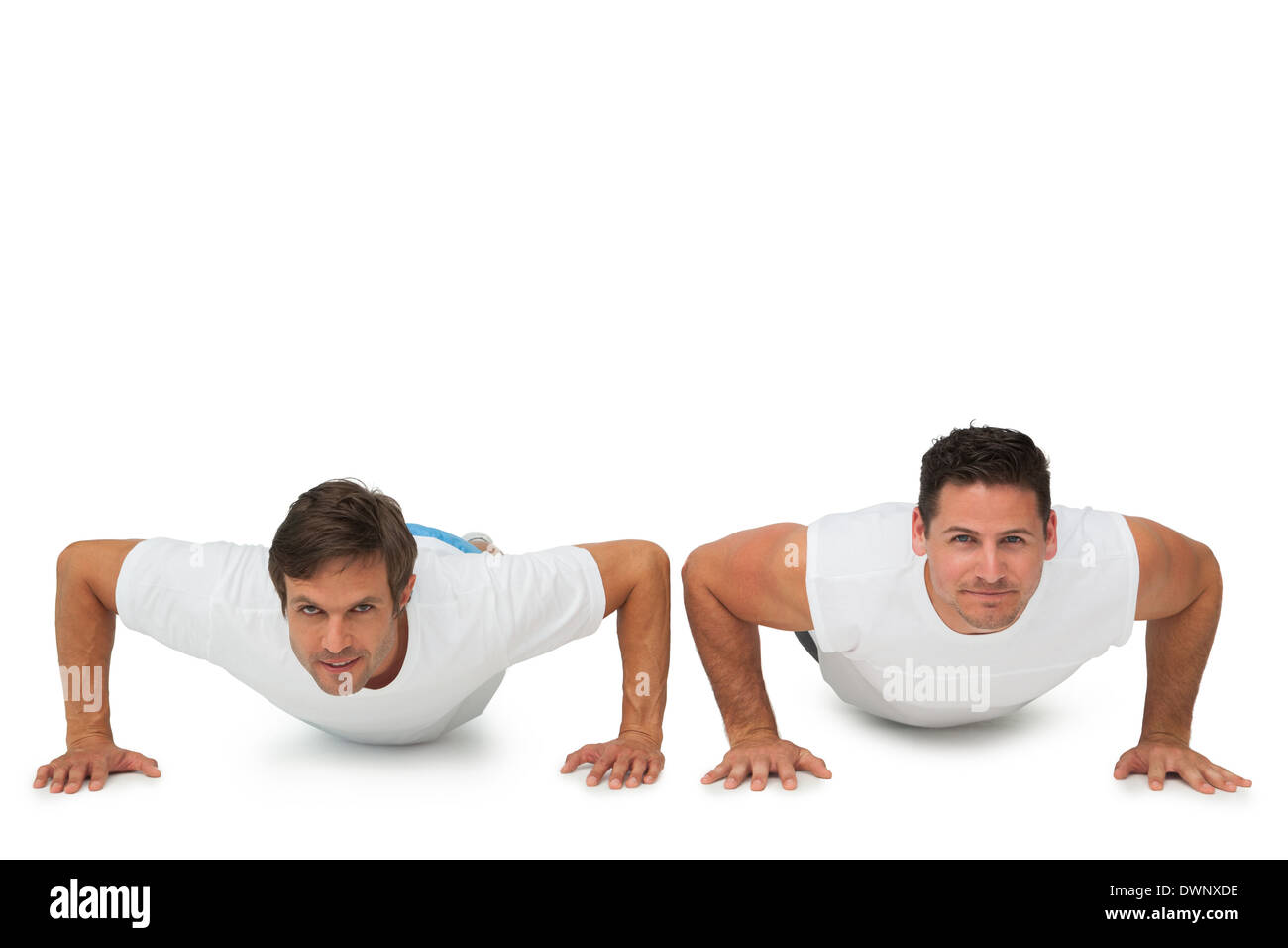 Portrait of two young men doing push ups Stock Photo - Alamy