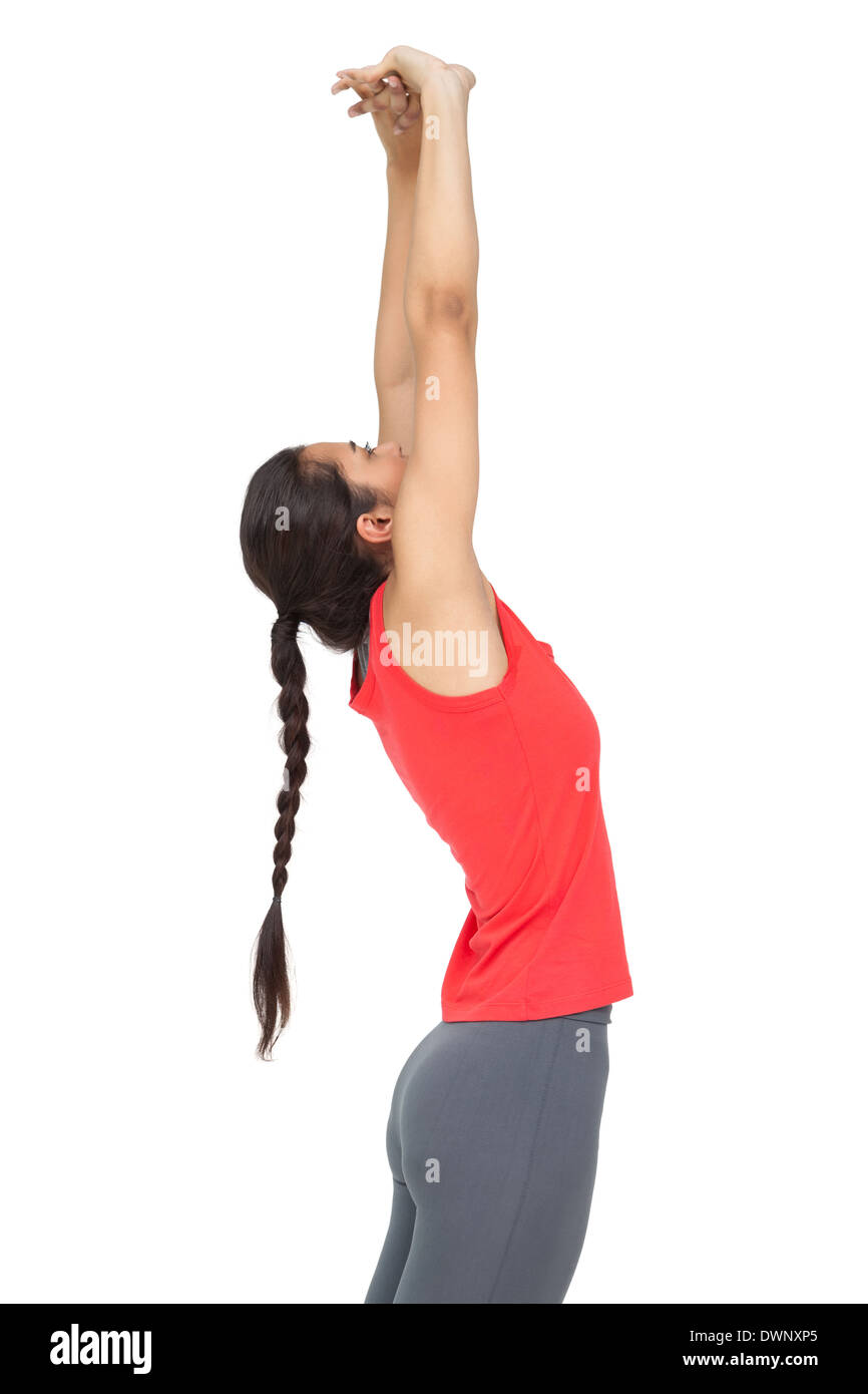 Side view of a sporty young woman stretching hands Stock Photo - Alamy