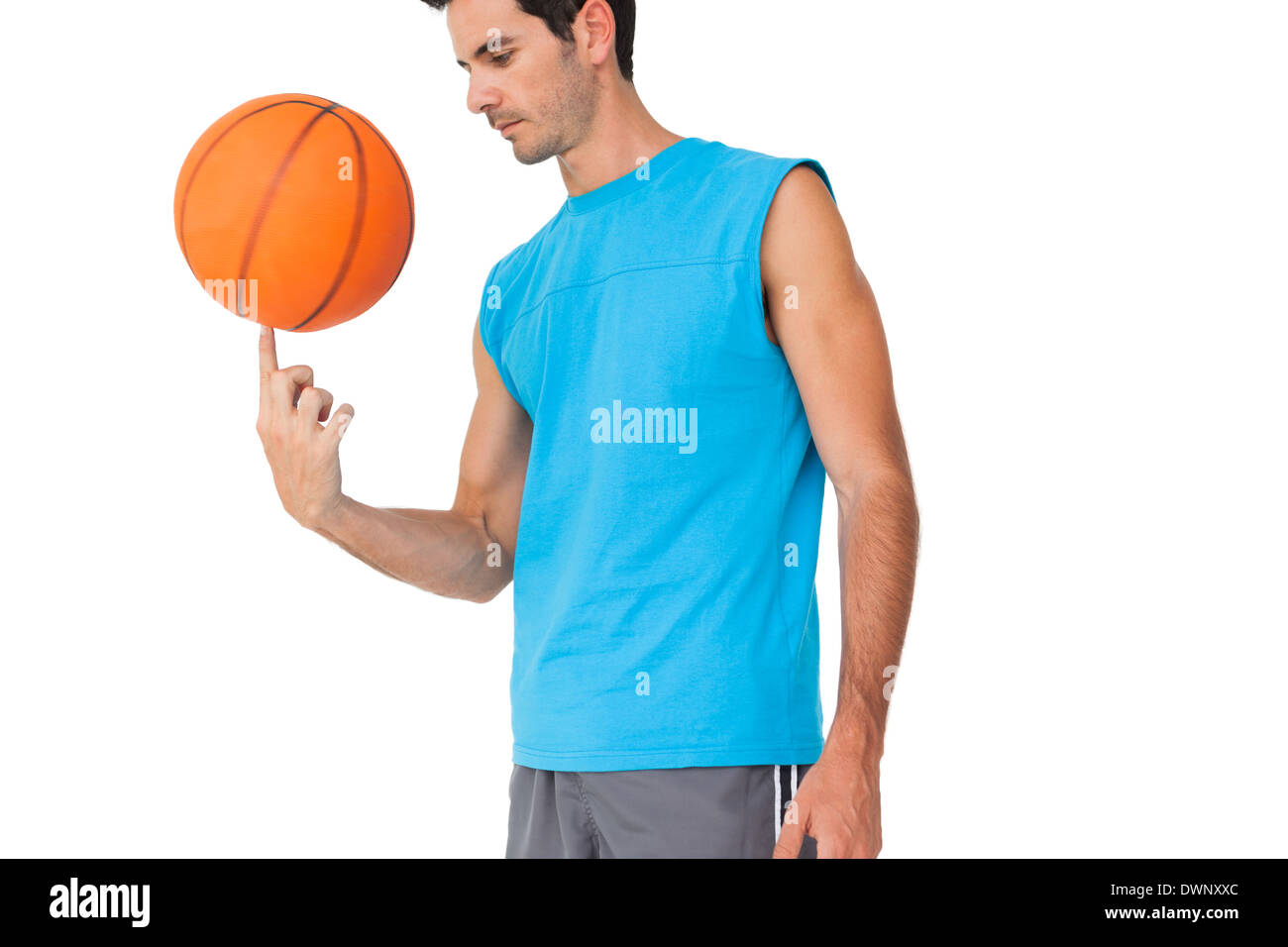 Basketball player holding ball on finger Stock Photo - Alamy