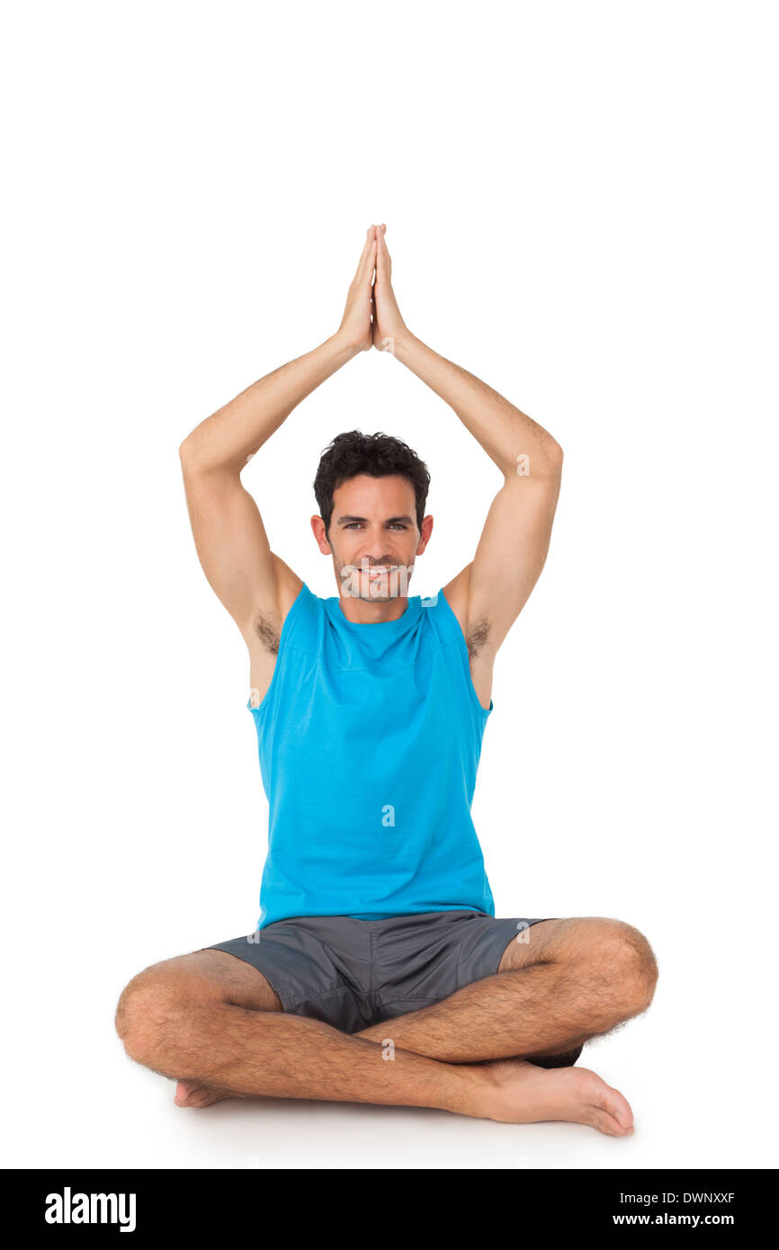 Full length portrait of a sporty men in meditation pose Stock Photo - Alamy