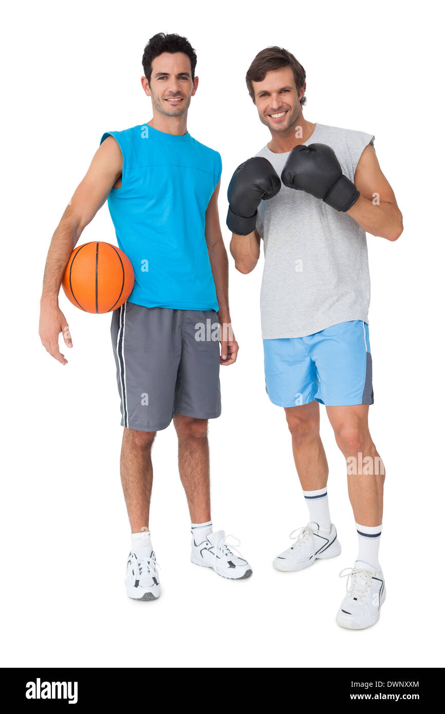 Two fit men with boxing gloves and basketball Stock Photo - Alamy