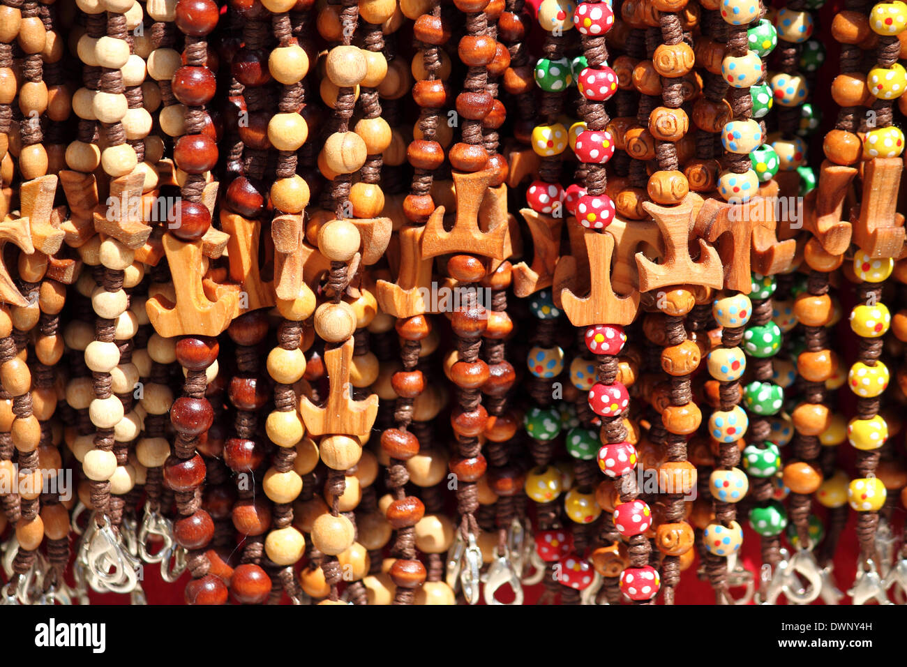 Colorful beads with tau cross, the franciscan symbol Stock Photo - Alamy