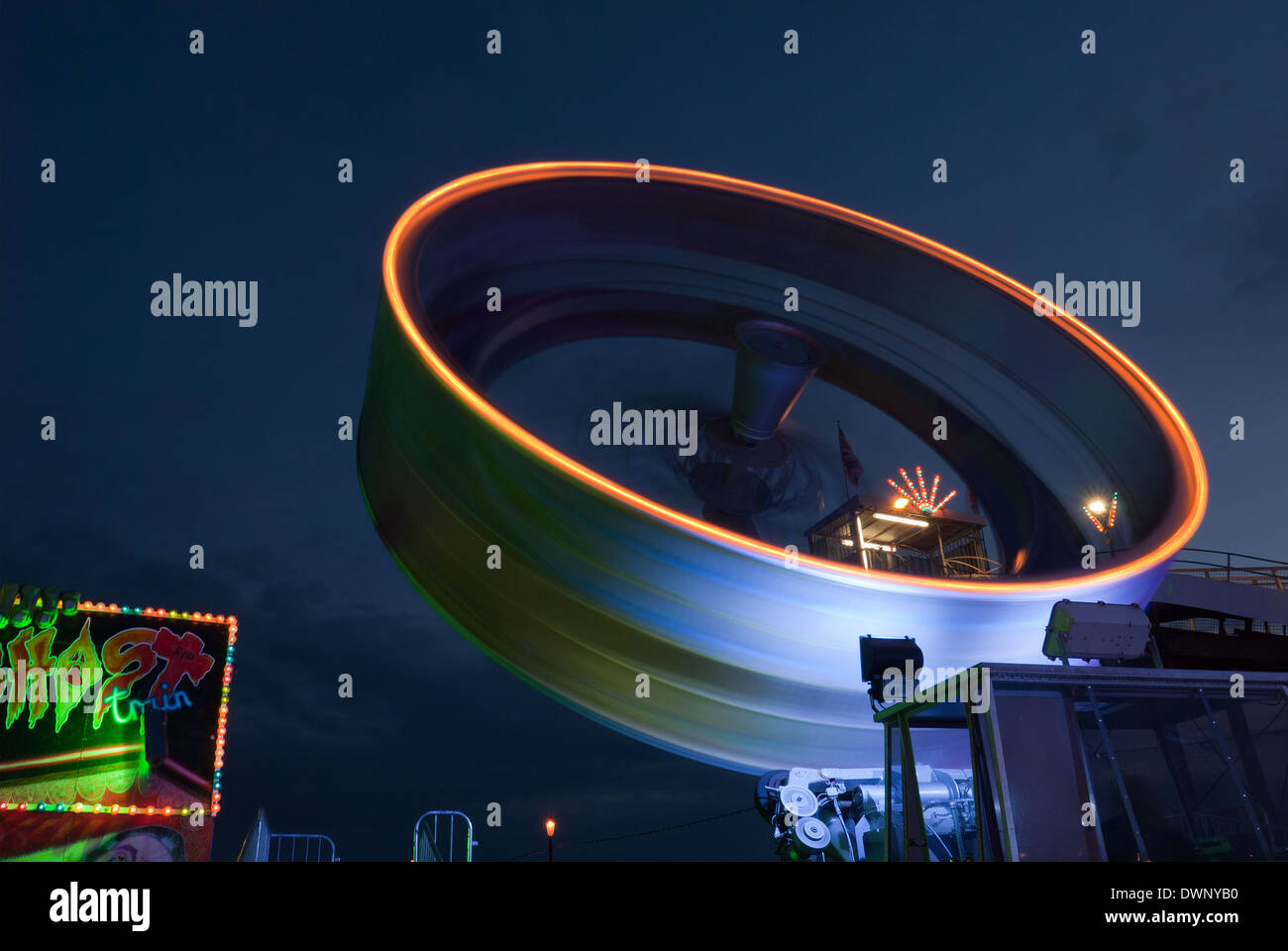 spinning funfair wheel wall of death or round-up standing and ...