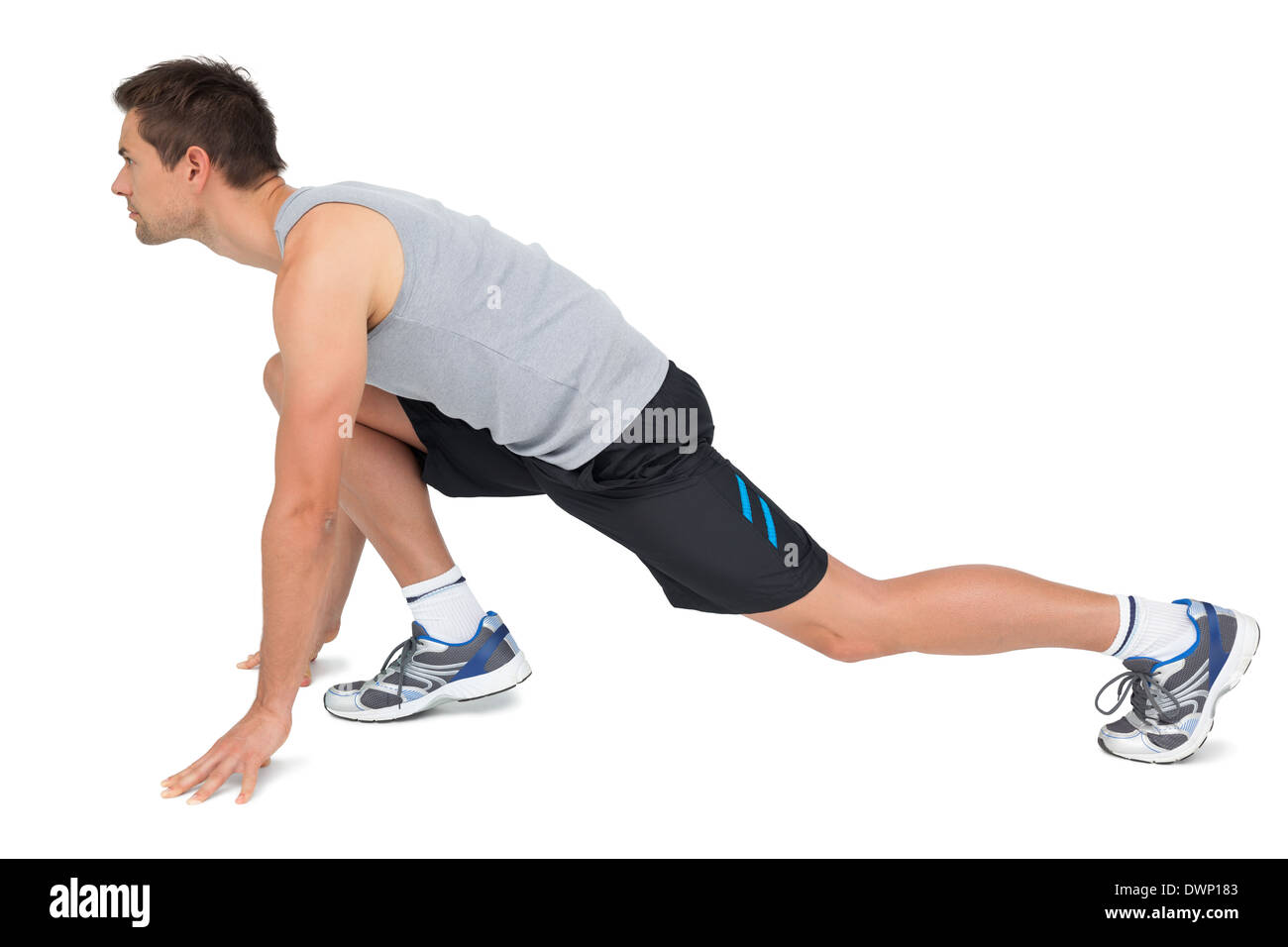 Side view of a young man in ready to run posture Stock Photo - Alamy