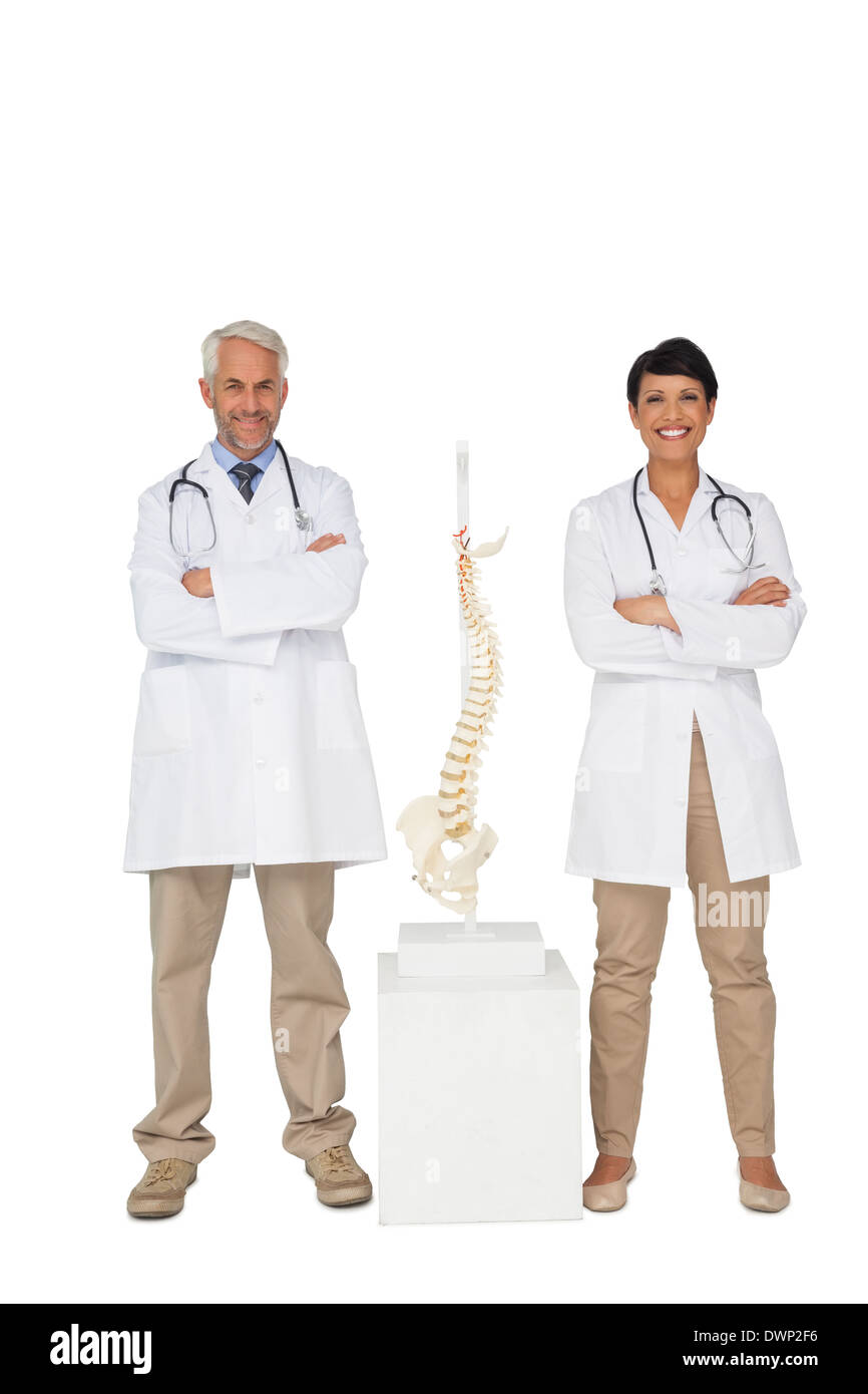 Portrait of two smiling doctors with skeleton model Stock Photo - Alamy